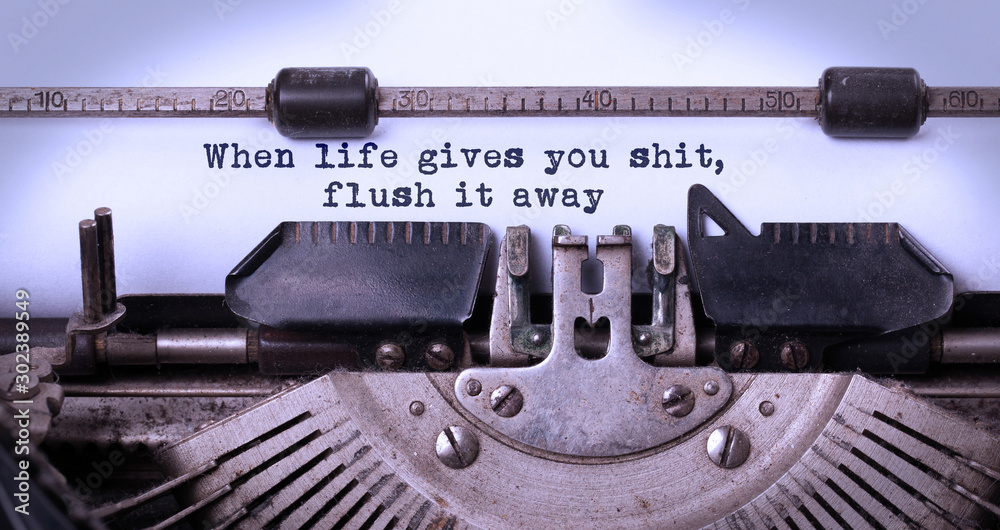 When life gives you shit, flush it away, written on an old typewriter ...