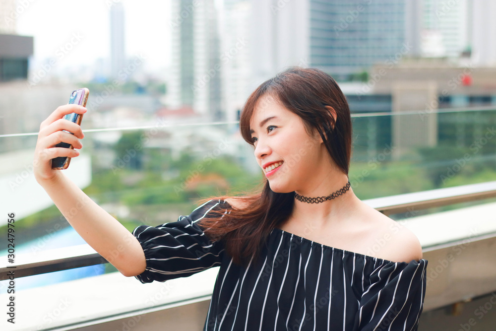 Asian Beautiful Girl Taking A Selfie On Rooftops Department Store In