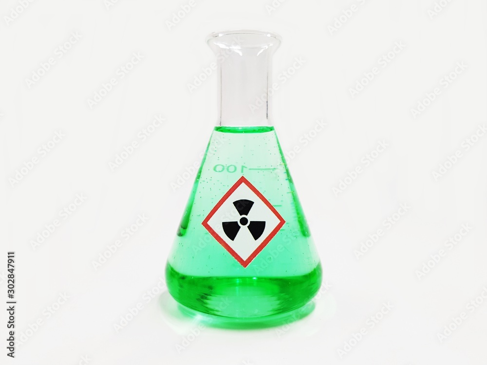 Erlenmeyer flask with green liquid and chemical hazard warning symbols ...