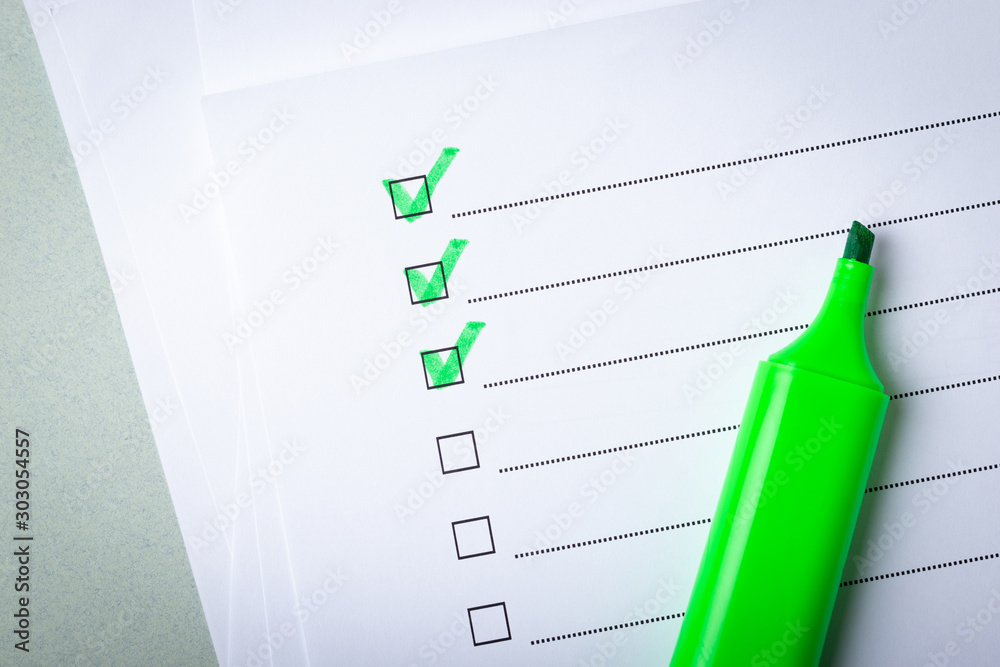 Check list and green marker Stock Photo | Adobe Stock