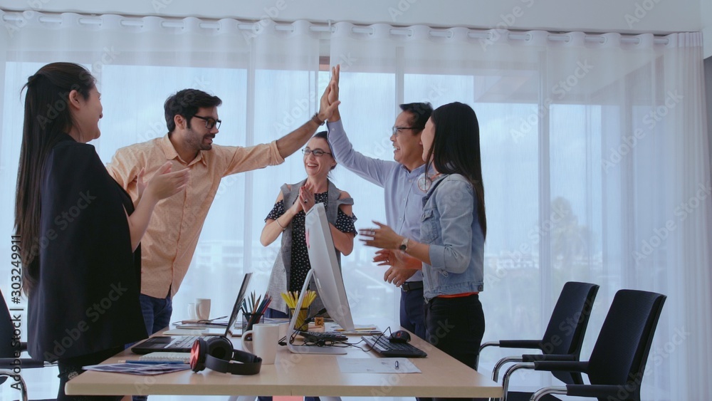 Successful business people group celebrating project success at office ...