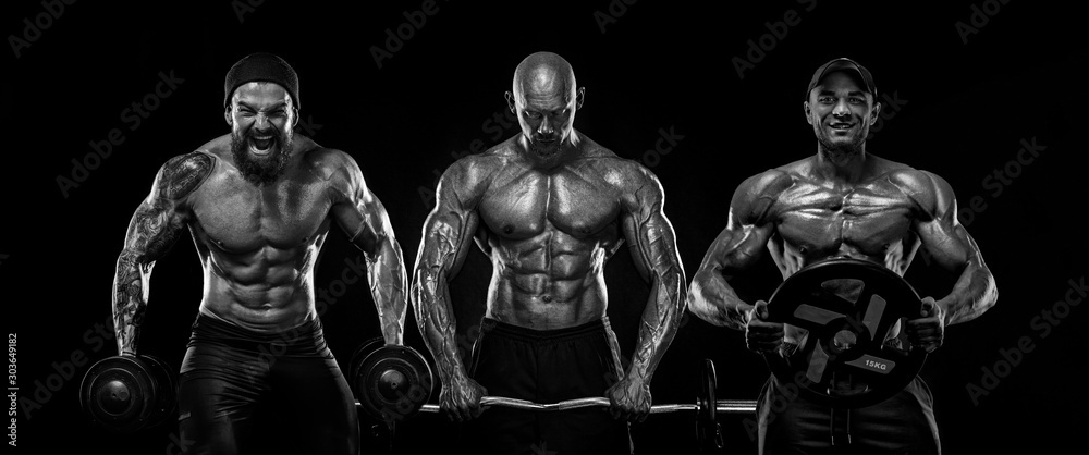 Three strong and fit men bodybuilders. Sporty muscular guys with ...