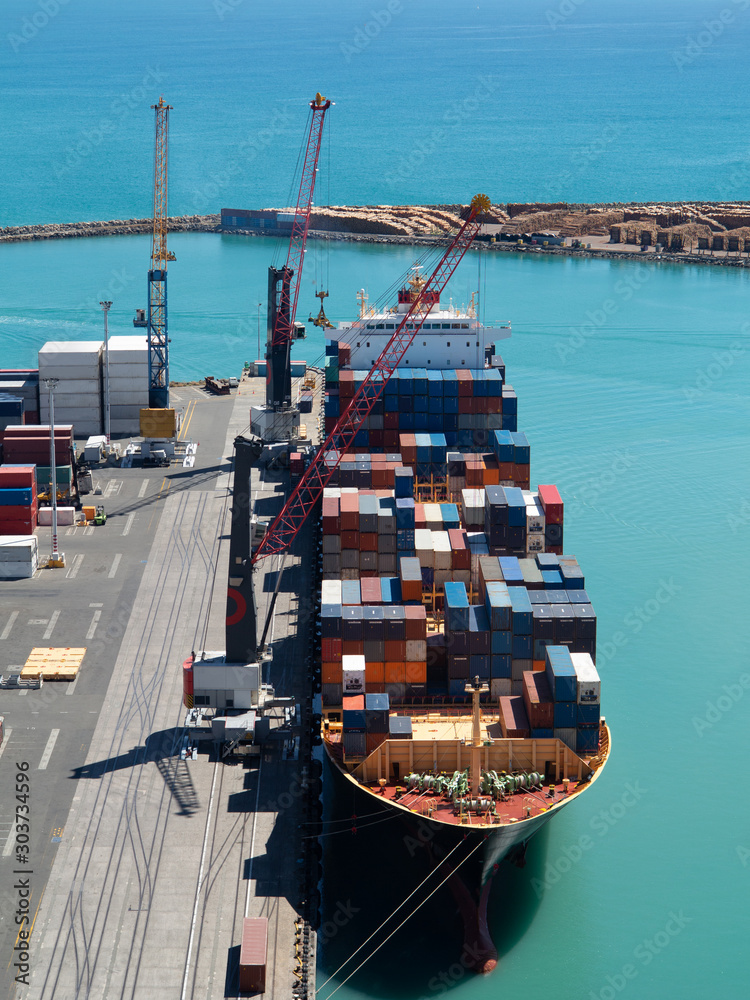 Container ship in New Zealand harbor. Export and import business and ...