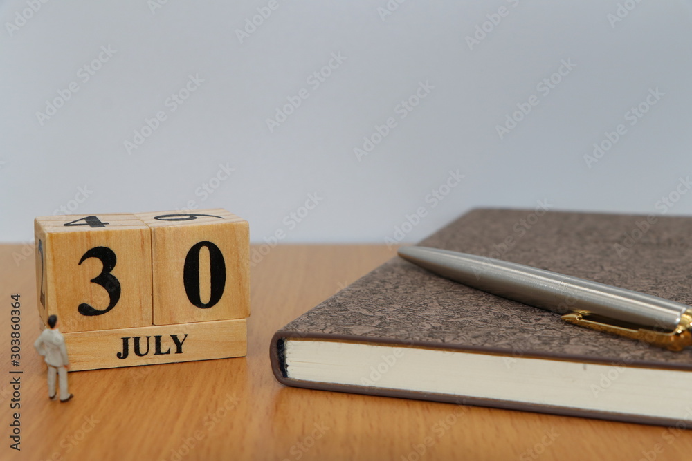 July 30, a calendar photo from the wood The table top consists of a ...