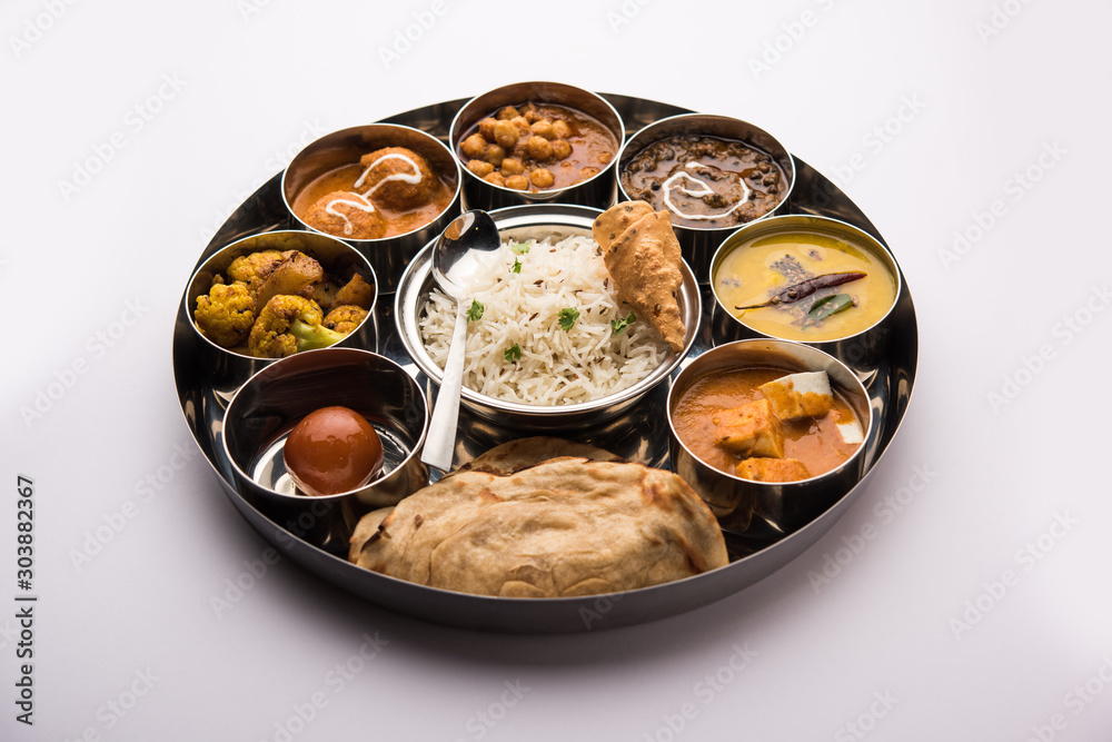 Indian vegetarian Food Thali or platter includes paneer butter masala ...