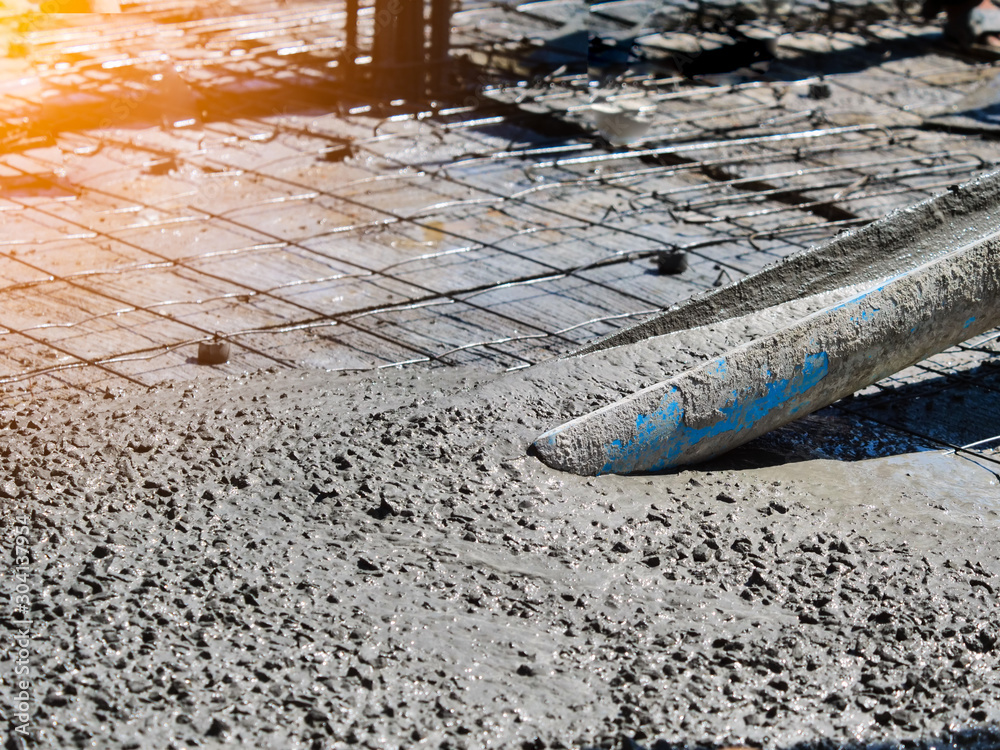 Construction worker Concrete pouring during commercial concreting ...
