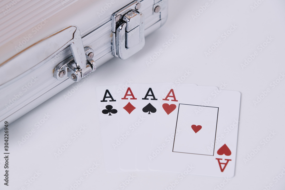 Game cards. Four cards, four aces, four symbols in background and white ...