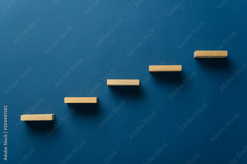 Wooden pegs forming a stairway Stock Photo | Adobe Stock
