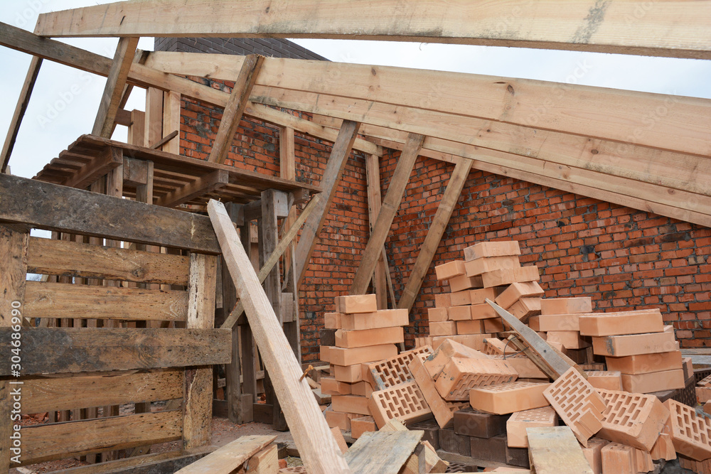 Unfinished house rooftop roofing construction attic trusses, wooden ...