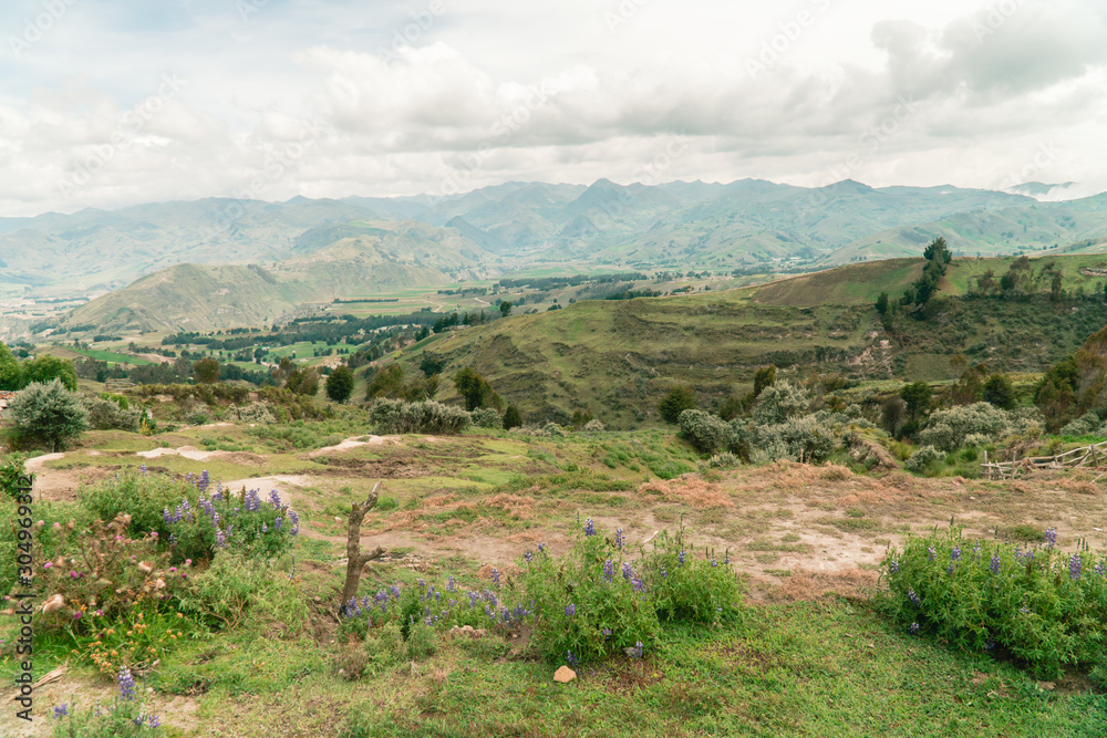 Quilotoa lake volcano greenery and landscape surrounding crater at ...
