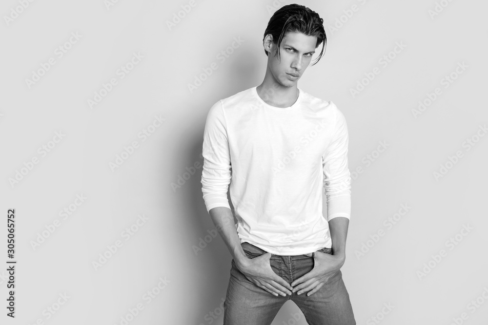 Muscle strong beautiful stripped male model portrait on isolated font ...