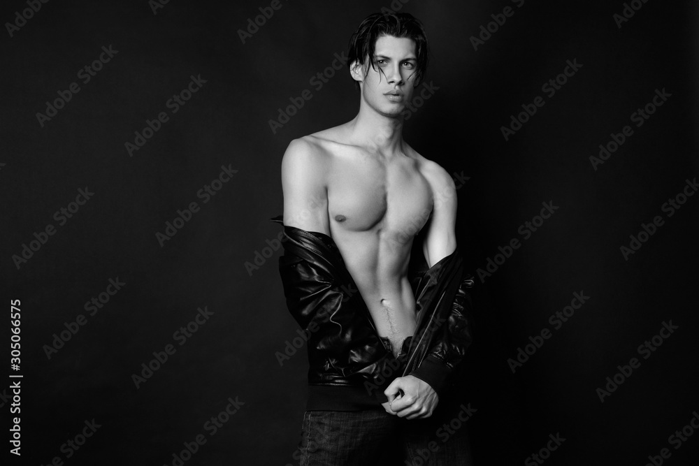 Muscle strong beautiful stripped male model portrait on isolated font ...