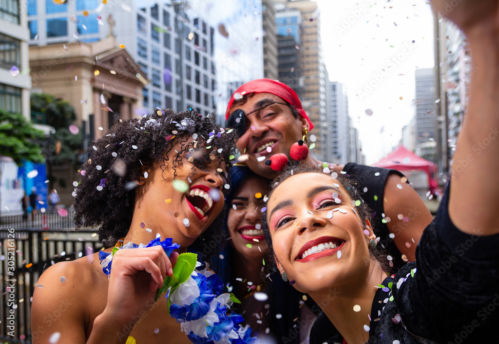 Girls taking selfie at street party parade, brazilian carnaval. Group ...