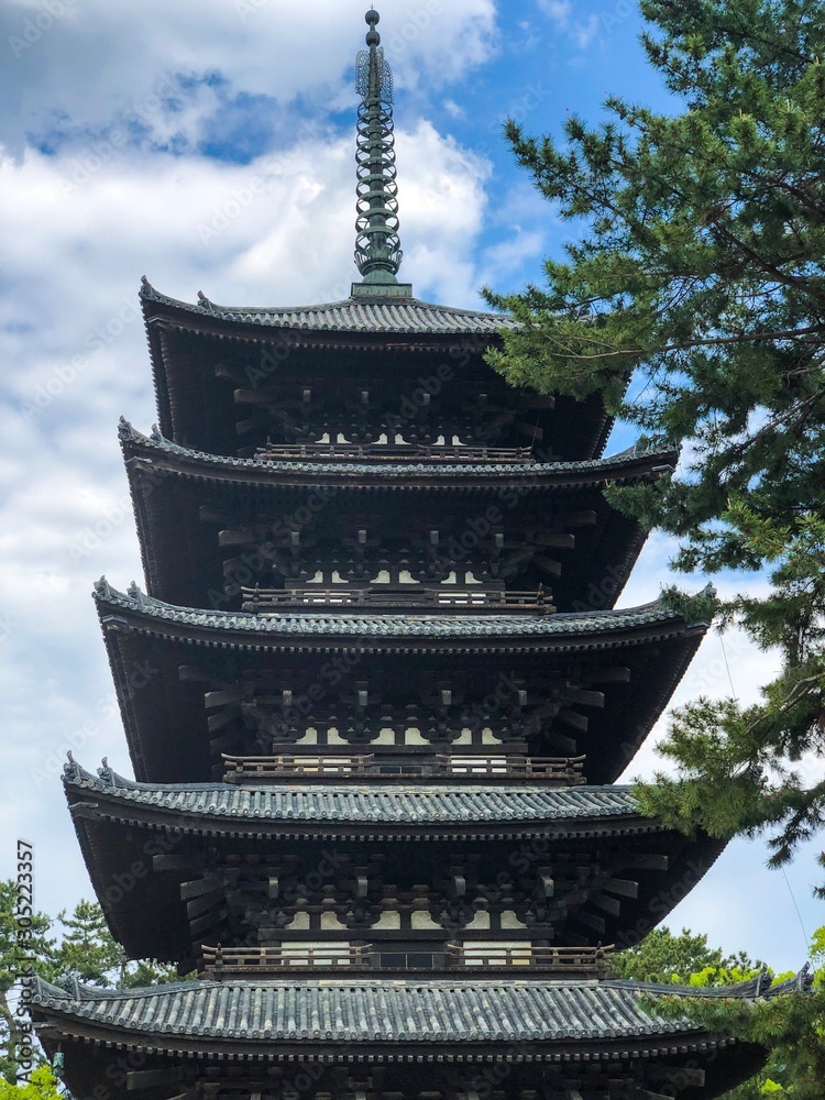 One of the Buddhist temples with its pagoda in the park part of the Japanese city of Nara Stock ...