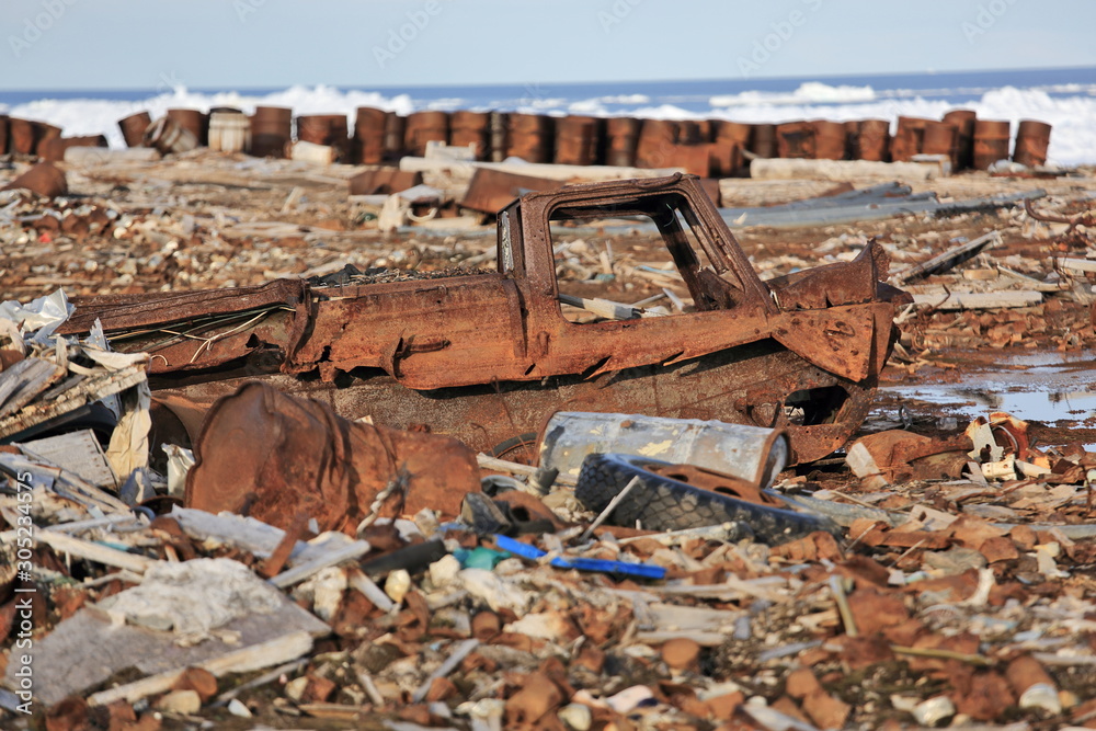 amphibious vehicle and piles of scrap metal waste in the Arctic Stock ...