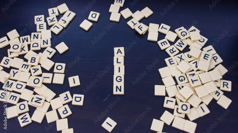 Align tile letters on a black background with mixed letters on either ...
