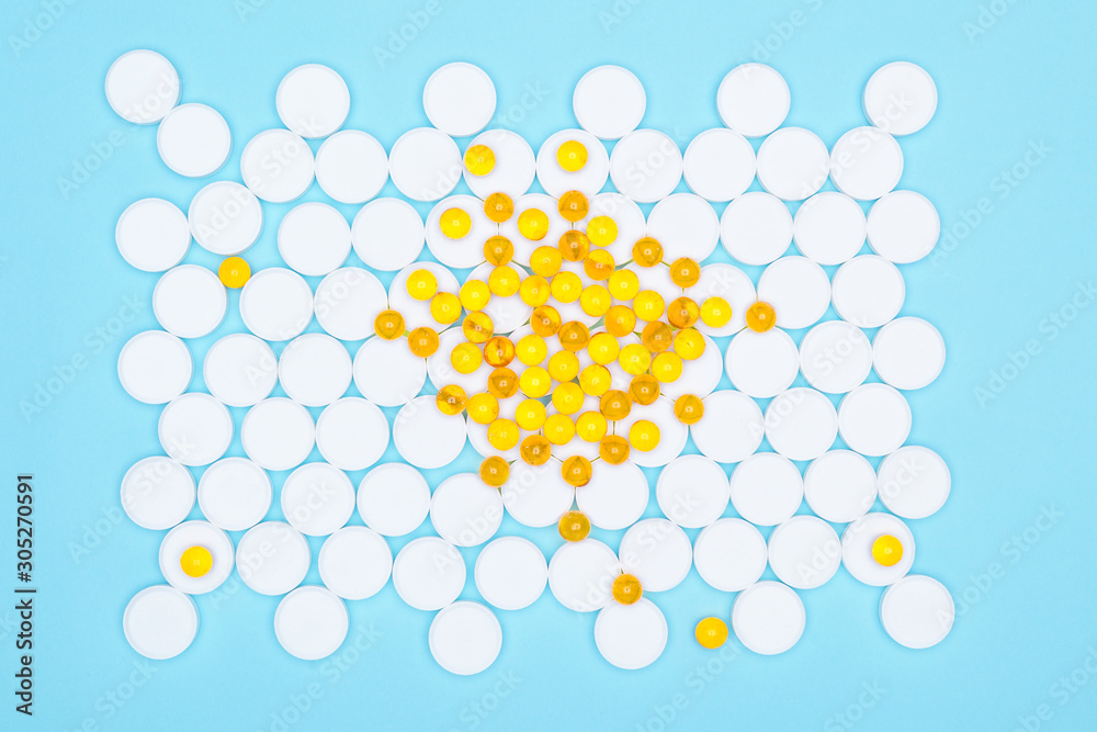 Fish oil omega-3 in yellow soft gelatin capsules pills arrange to be ...