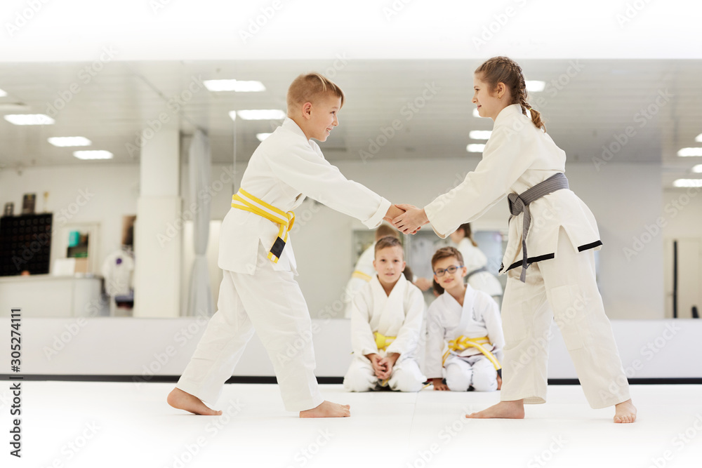 Boy and girl standing opposite the each other and fighting with other ...