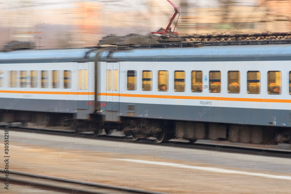Blurred stripes and tracing from headlights. Electric train in motion ...
