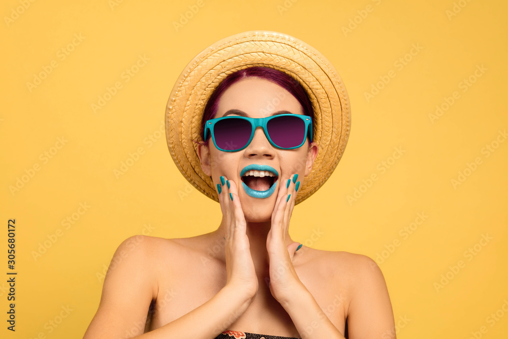 Portrait of beautiful woman with bright make-up, hat and sunglasses on ...