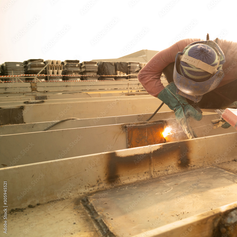 Welder is Steel welding, Welding sparks form Welding rod no.50, photo ...