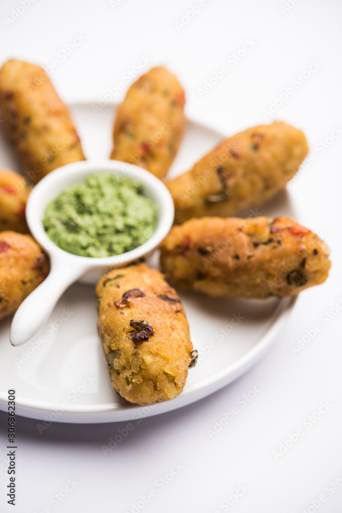 Veg Poha Roll made using flattened Rice, served with tomato ketchup and ...