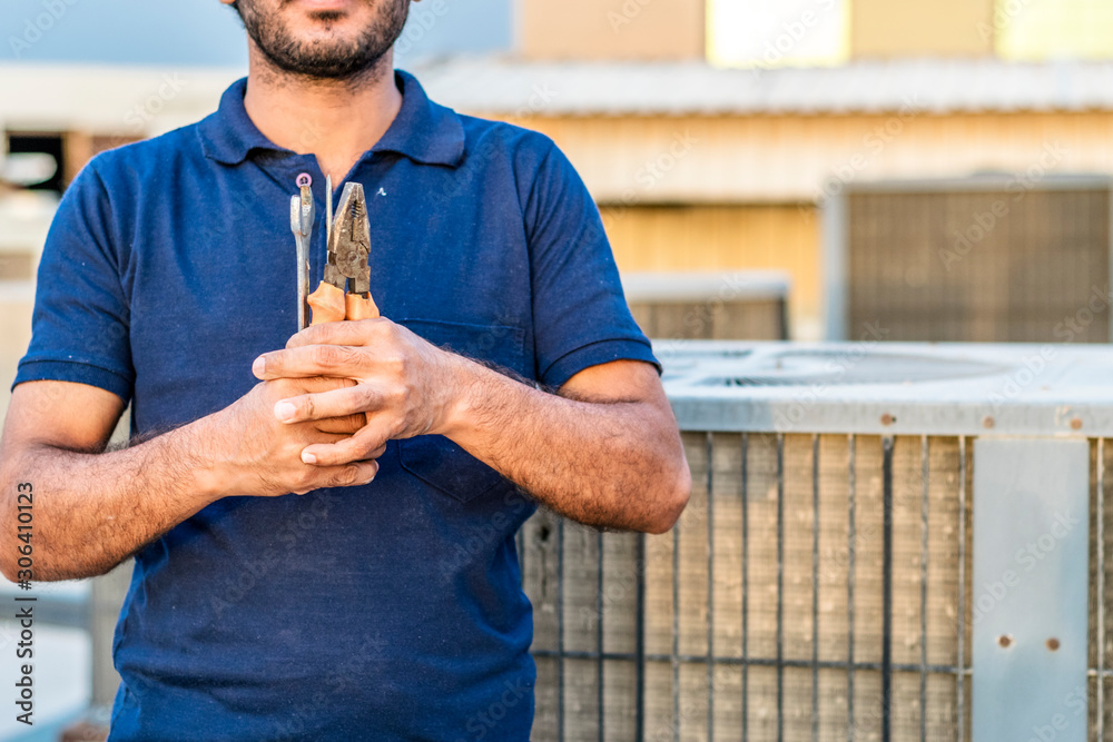 a professional electrician man is feeling proud after fixing the ...