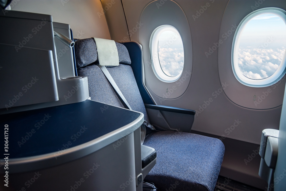 Airplane cabin business class interior Stock Photo | Adobe Stock