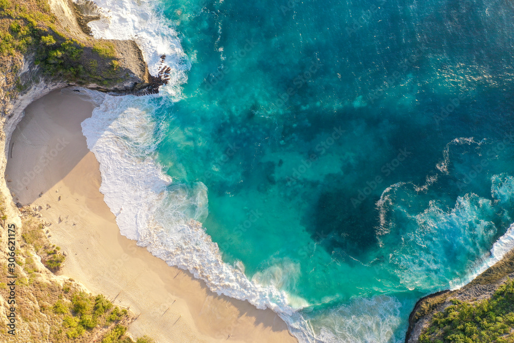 Aerial view of the Kelingking Beach aka Manta Bay with the amazing big ...