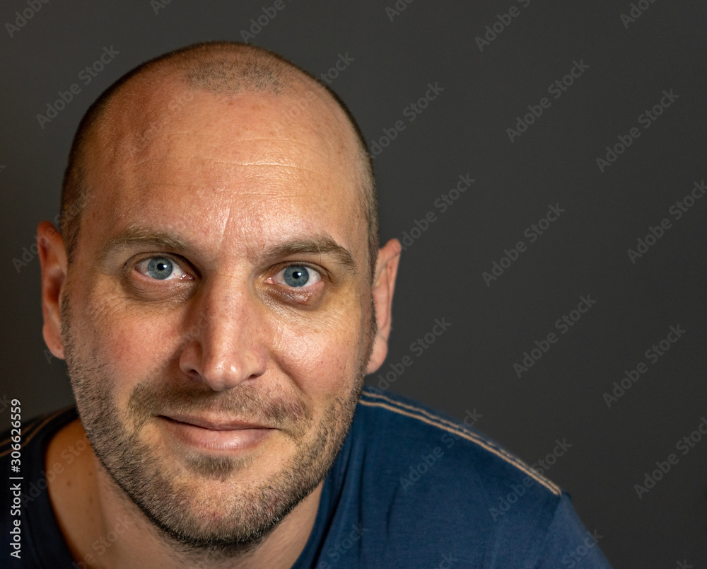 portrait of bald man with blue eyes Stock Photo | Adobe Stock