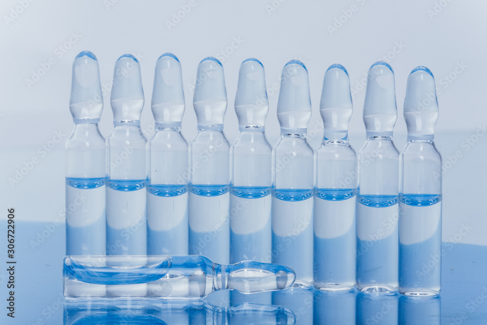 Glass medical ampoule vial for injection. Medicine is liquid sodium ...