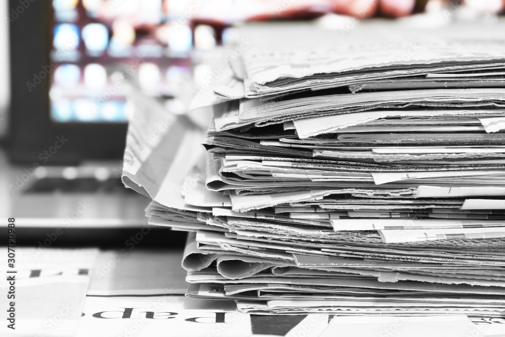 Newspapers and Laptop. Different Concepts for News - Social Network or ...