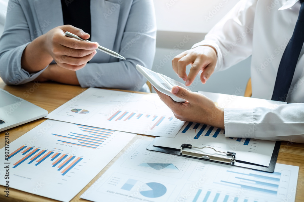 Two business partner team meeting and discussion financial project of ...