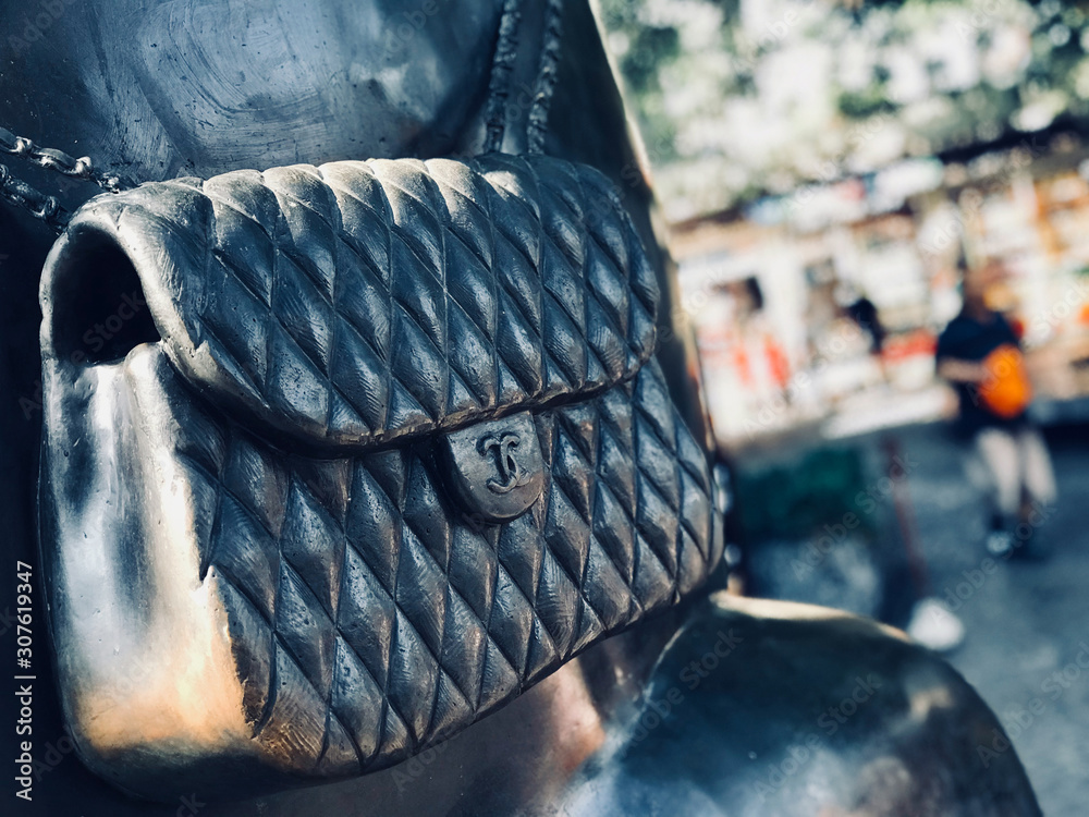 Stunning sculpture of big black cat with brandname bag of Chanel brand ...
