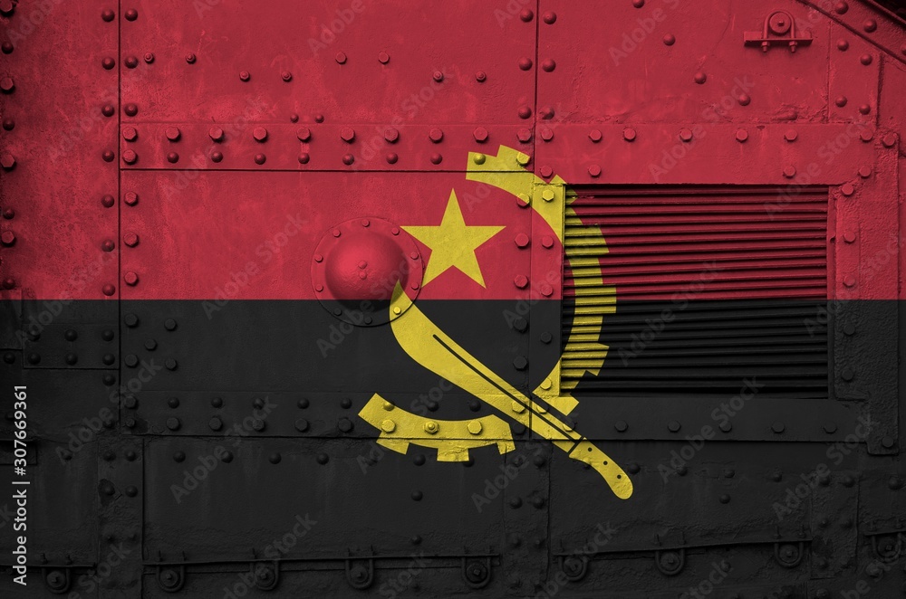 Angola flag depicted on side part of military armored tank closeup ...