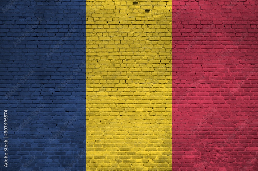 Chad flag depicted in paint colors on old brick wall. Textured banner ...