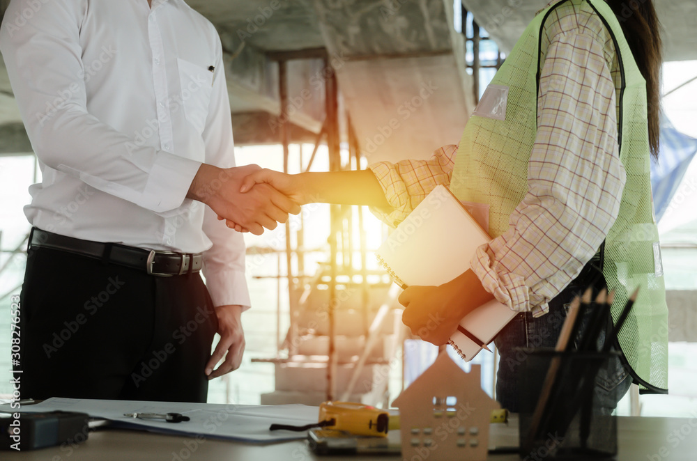 construction worker team handshake after consultation meeting to ...
