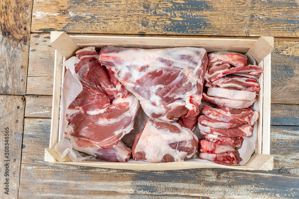 Fresh and raw sheep or lamb meat pieces for sale on box from the farm ...