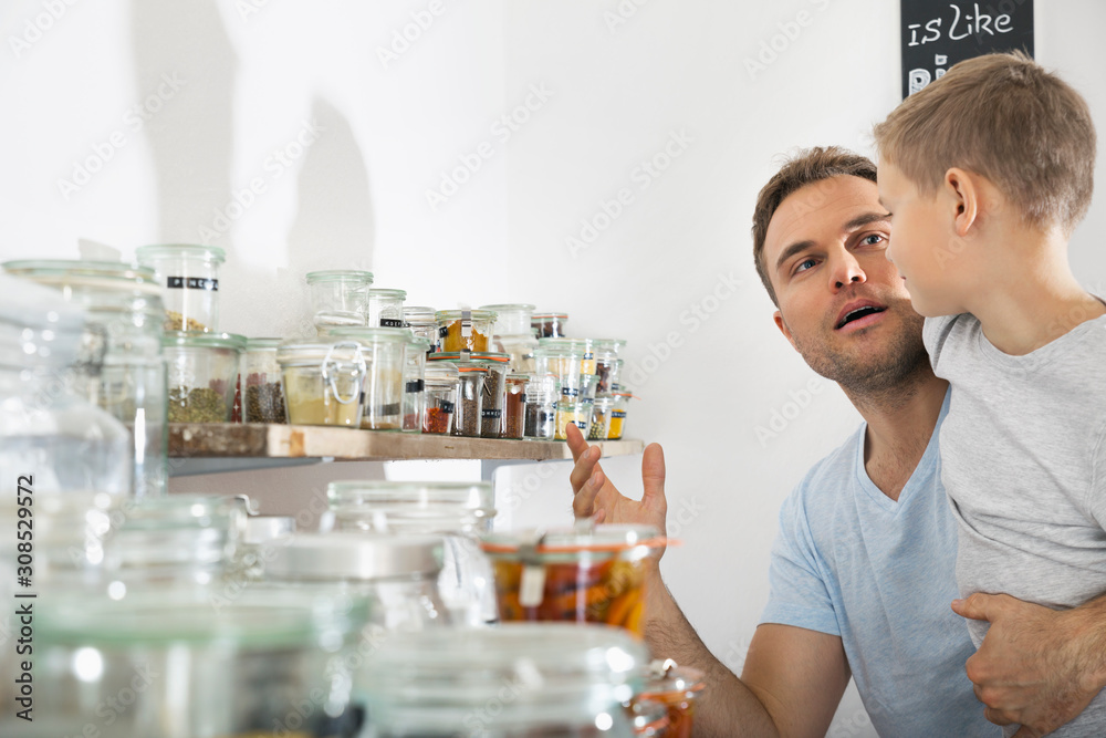 Father explaining his son spices Stock Photo | Adobe Stock