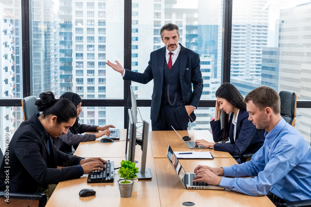 Moody or angry boss complaining team about mistake in workplace concept ...