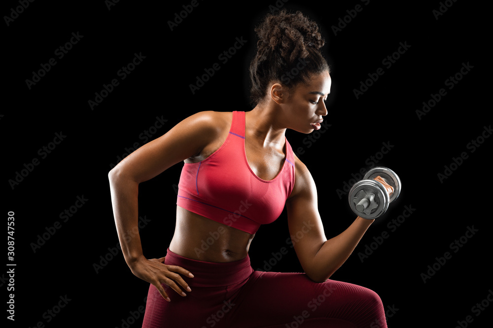 African woman bodybuilder doing single arm dumbbell curl Stock Photo ...