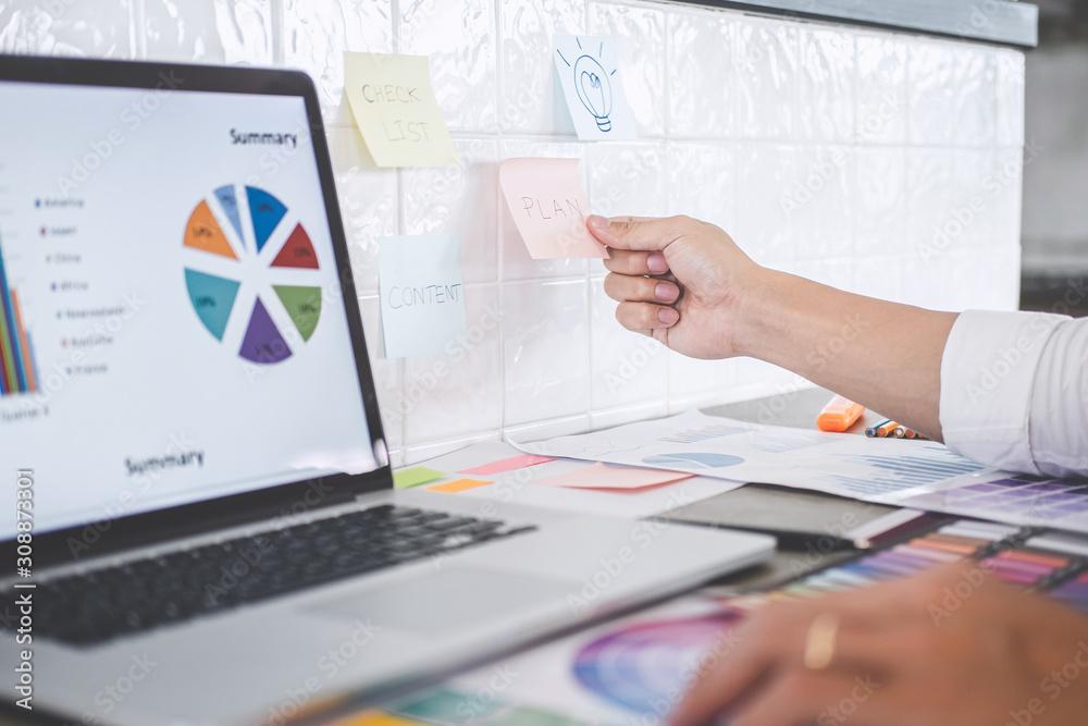 Young creative graphic designer working on project architectural ...