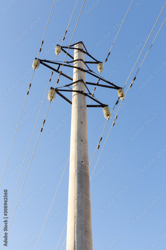 Concrete pillar power lines with steel traverses, porcelain insulators ...