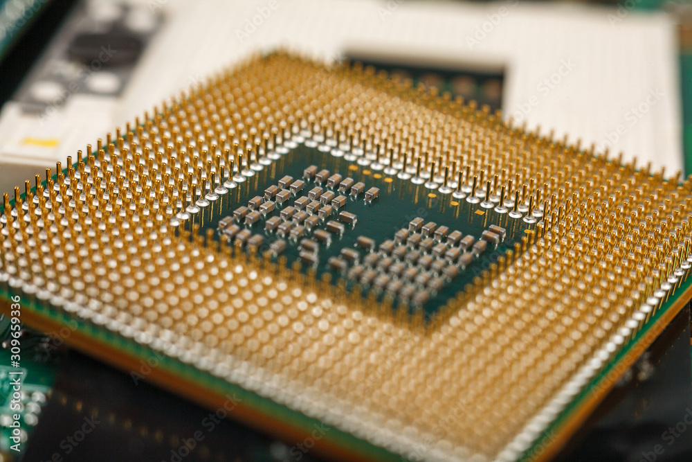 computer CPU close-up on the motherboard background, socket of central process unit, connection ...