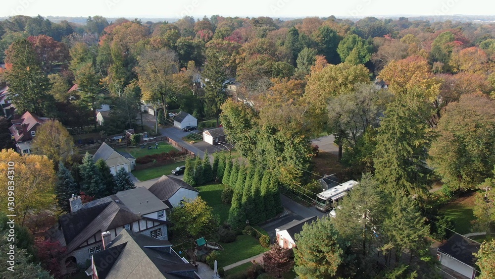 Colorful autumn foliage in suburban area, vintage villas and mansions ...