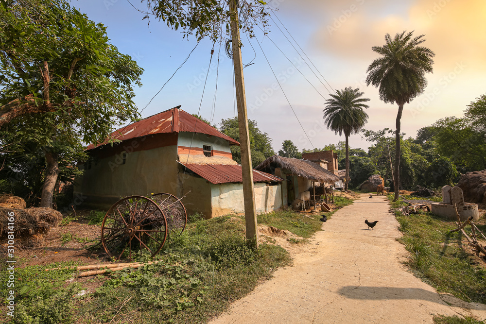 Indian tribal village at Bolpur, West Bengal India with view of mud hut ...