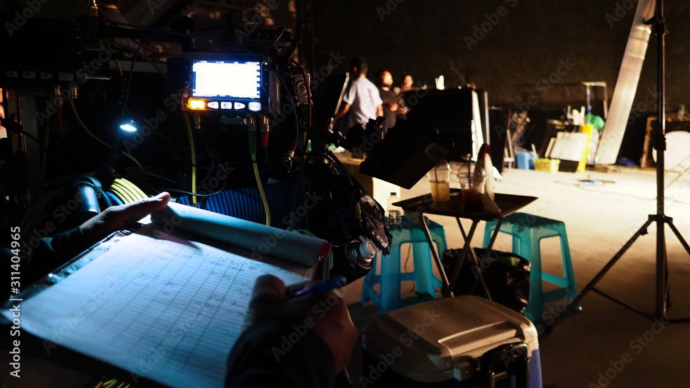 Behind the scenes of video or movie production in big studio and blue ...