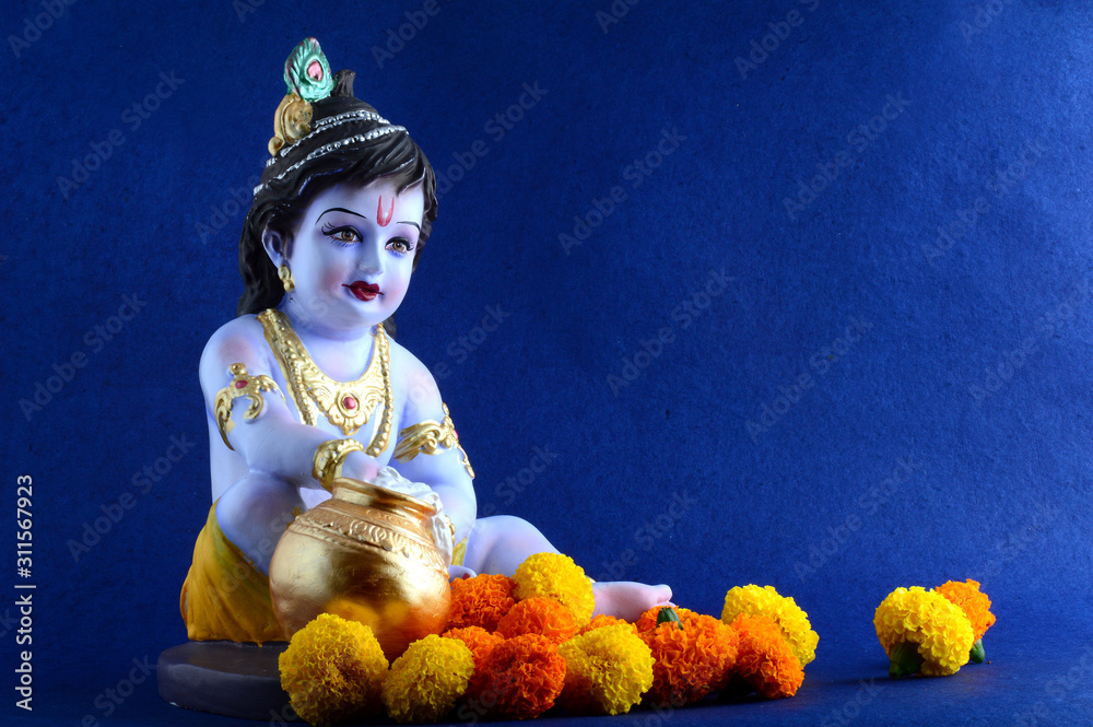 Hindu God Krishna on blue background Stock Photo | Adobe Stock