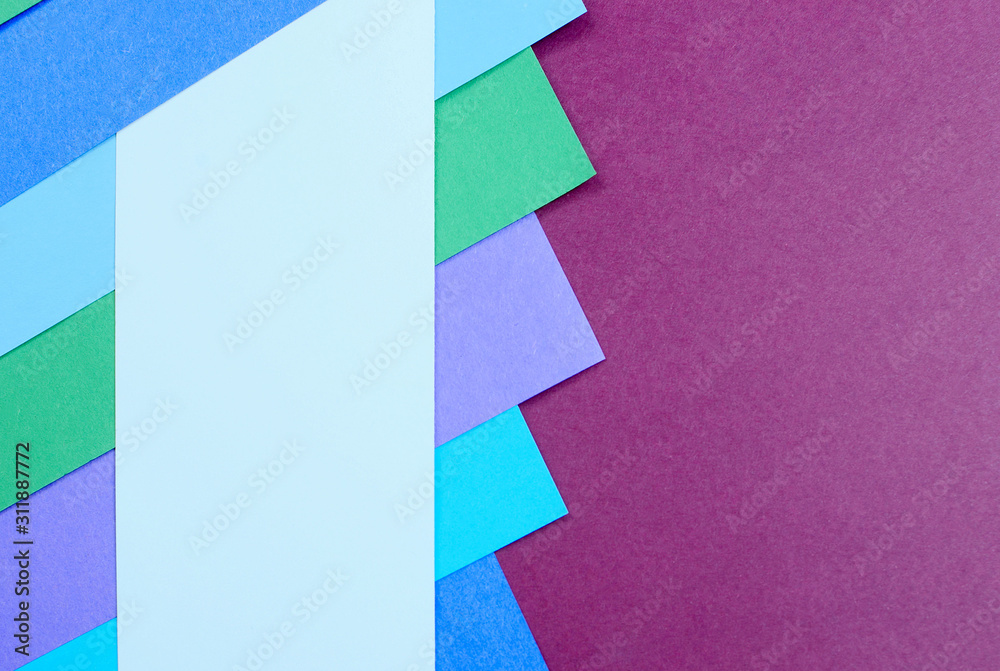 Layers of colored, rough textured construction paper creating a graphic ...