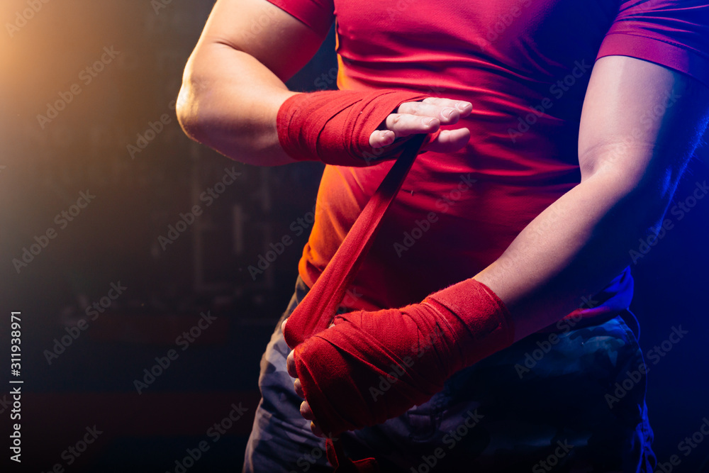 strong man wrapping his hands with boxing hands tape - close up - fight ...